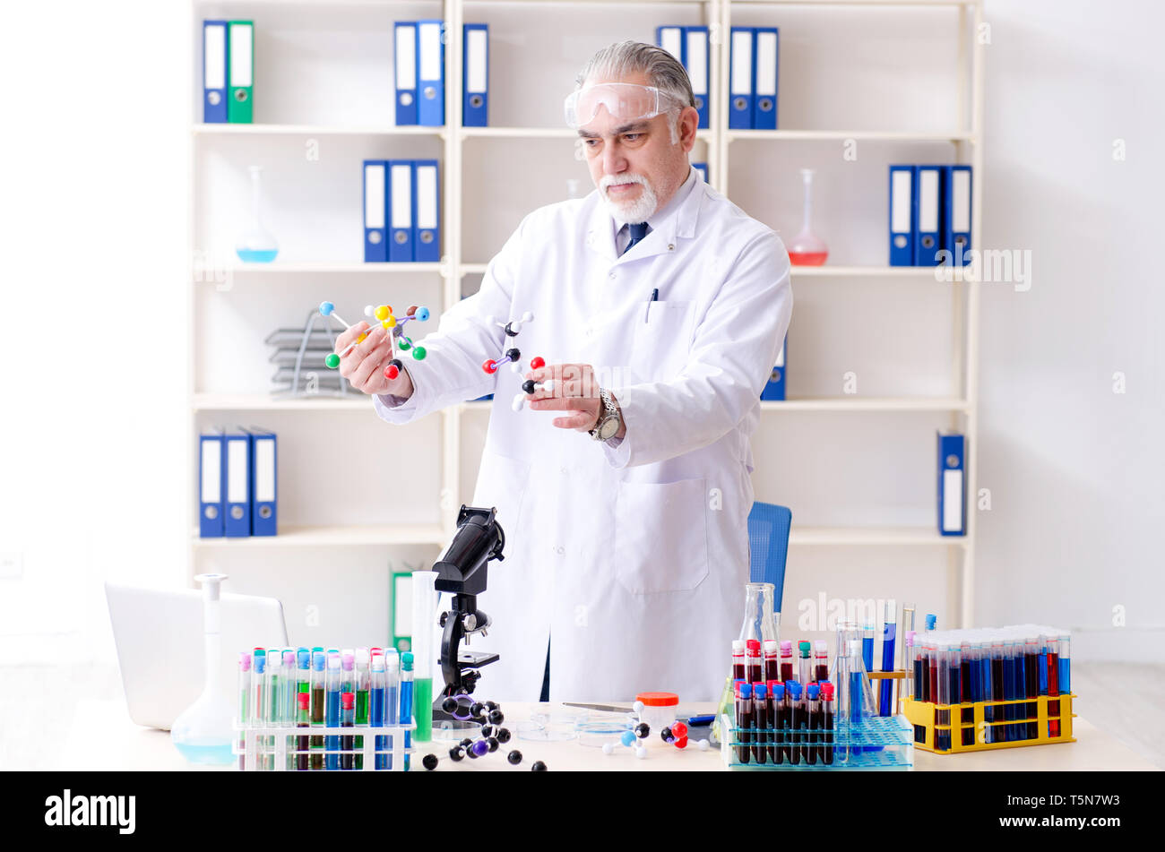 Focused senior old doctor working hi-res stock photography and images ...