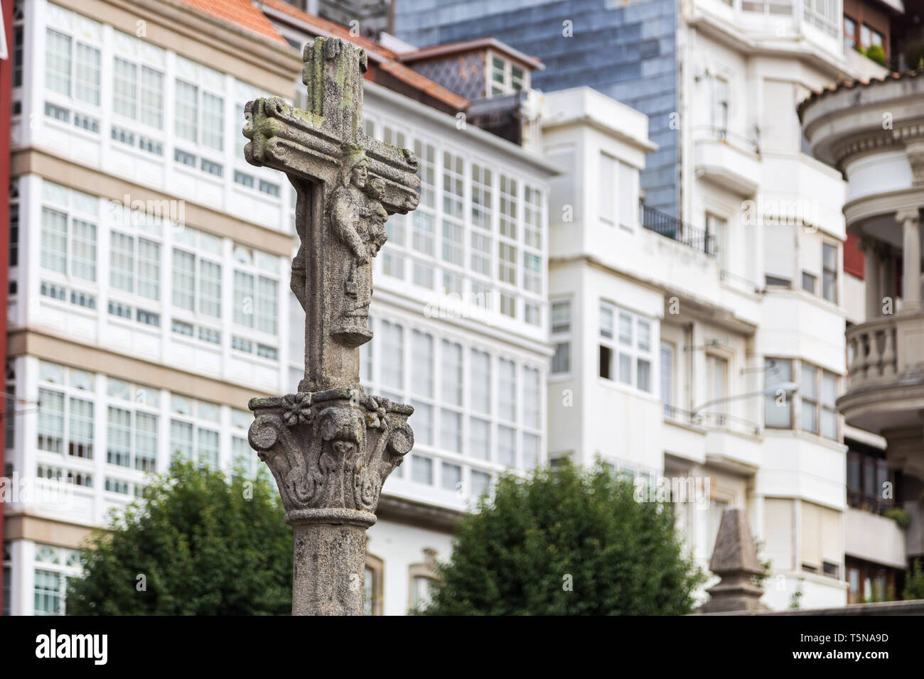 view of a stone cross, typical of Galician culture, with typical ...