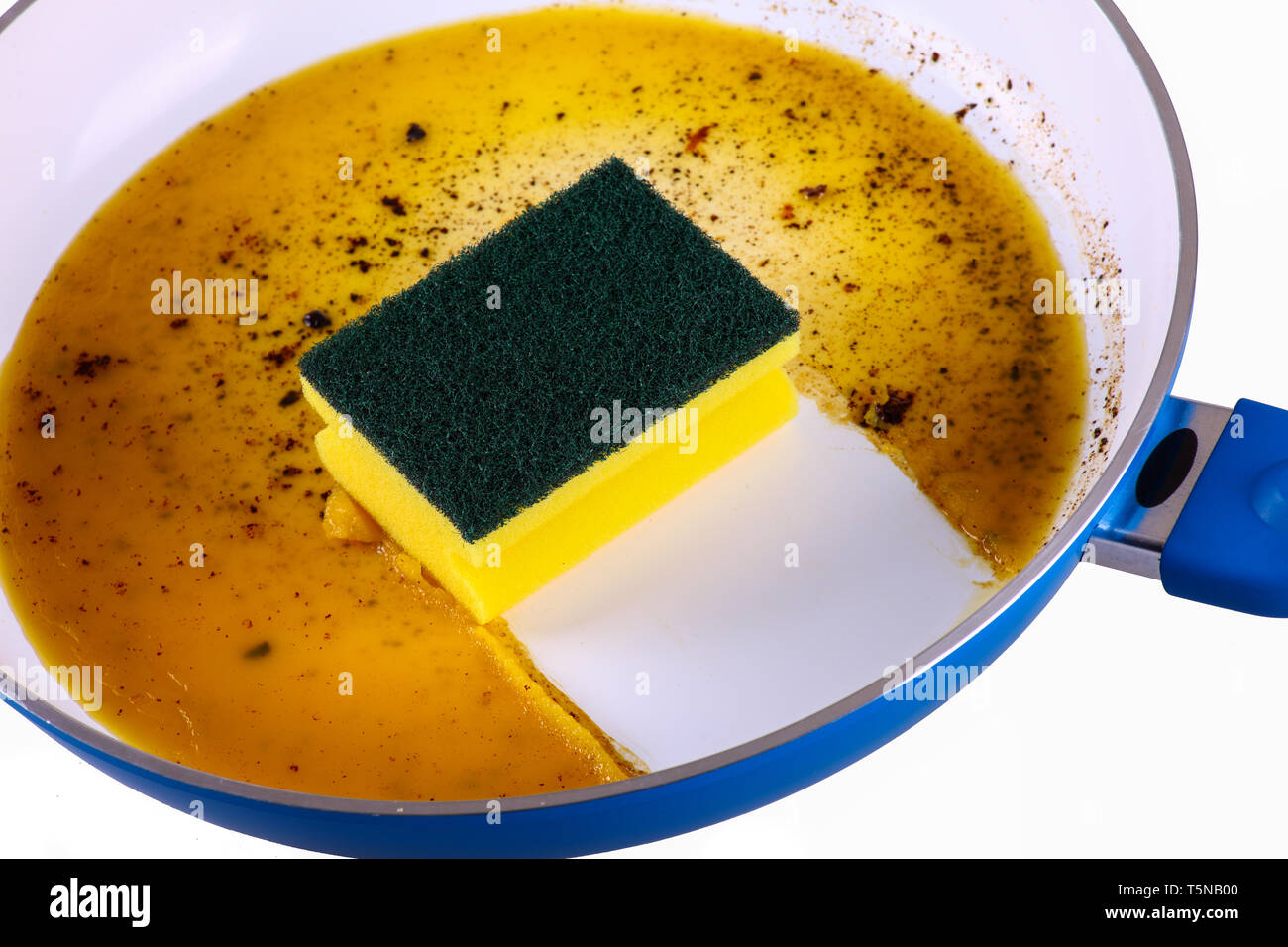 Sponge in clean a frying pan - isolated Stock Photo - Alamy