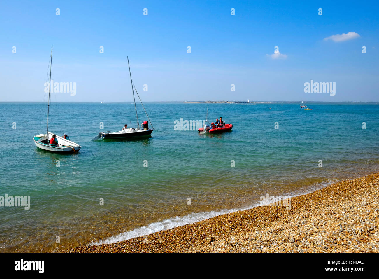 Small sailing boats anchored just off the beach at Colwell Bay in ...