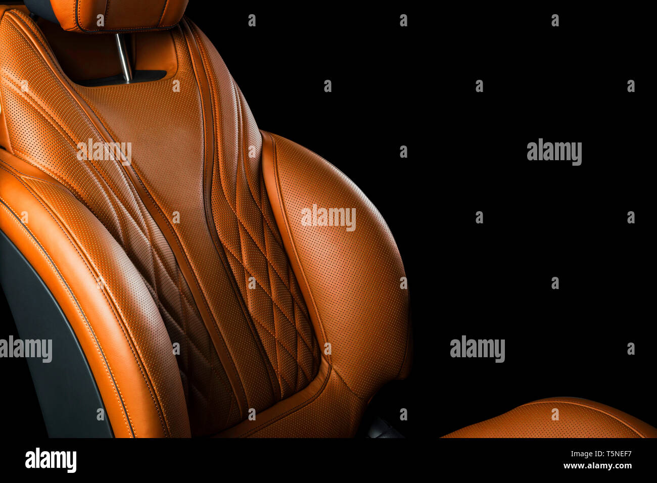 Brown leather interior of the luxury modern car. Perforated orange ...