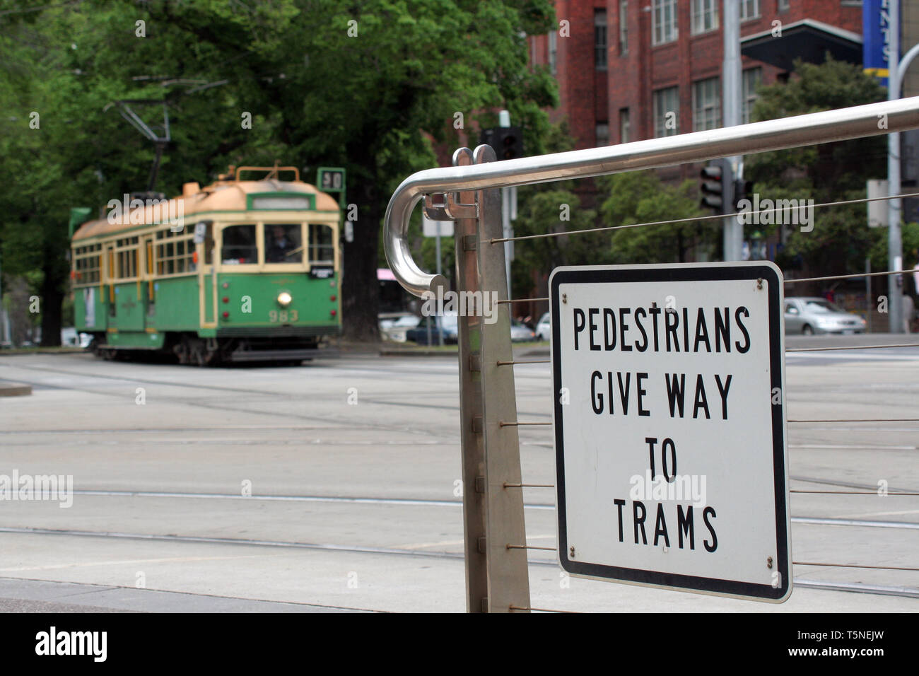 PEDESTRIANS GIVE WAY TO TRAMS SIGN, TRAM IN BACKGROUND, MELBOURNE ...