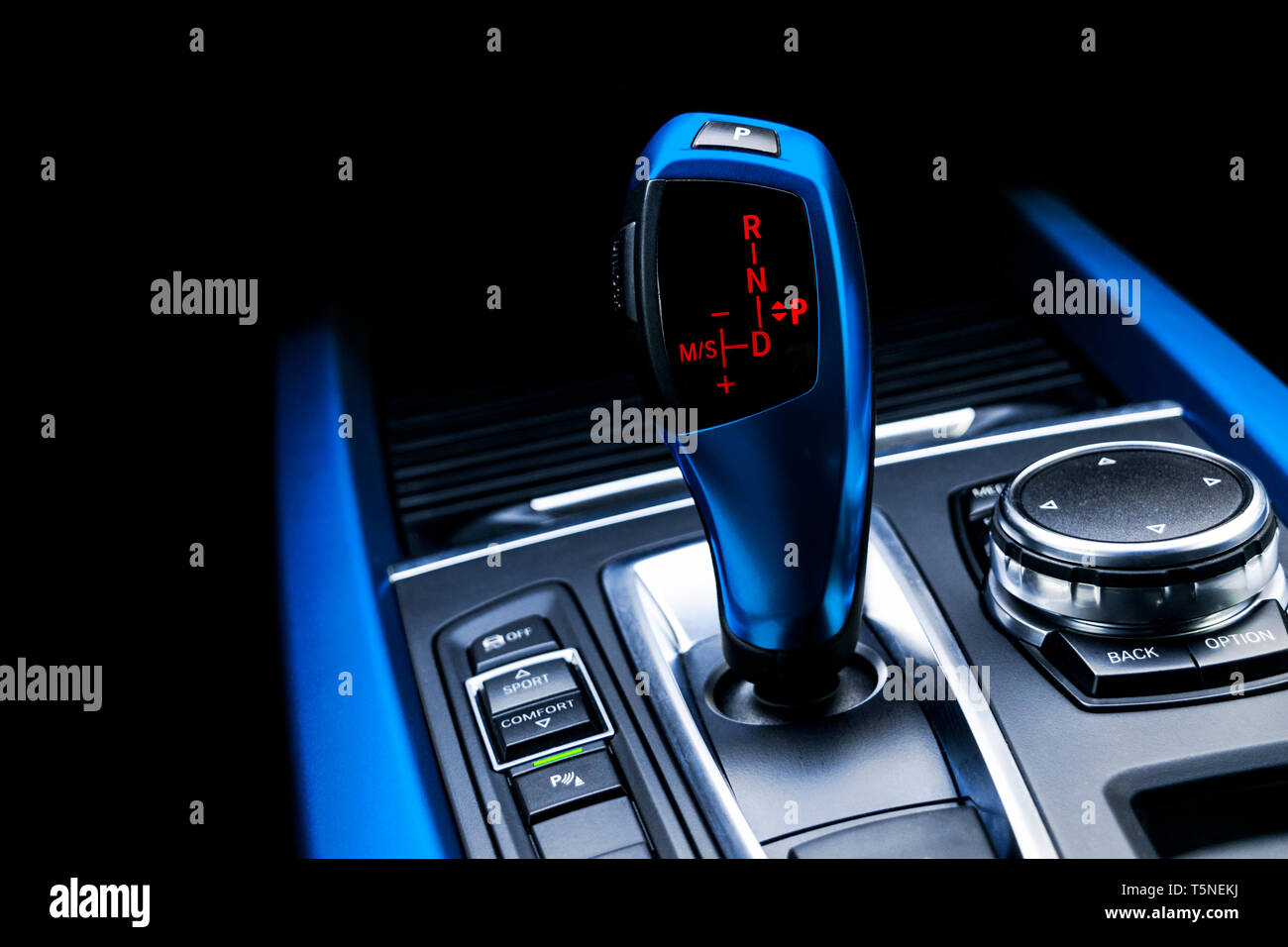 Blue Automatic gear stick of a modern car. Maodern car interior details. Close up view. Car ...