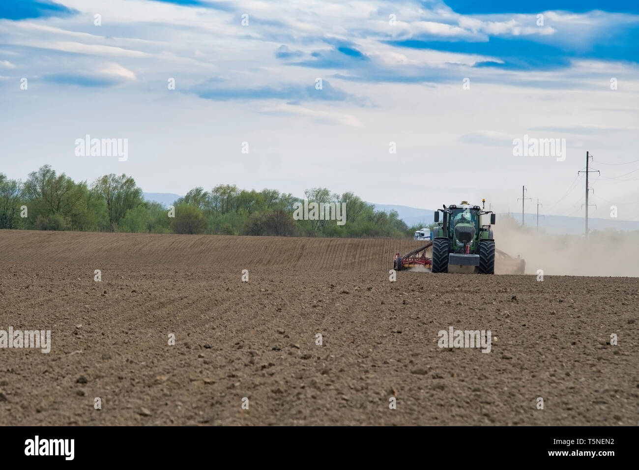 Farmer seeding, sowing crops at field. Sowing is the process of ...