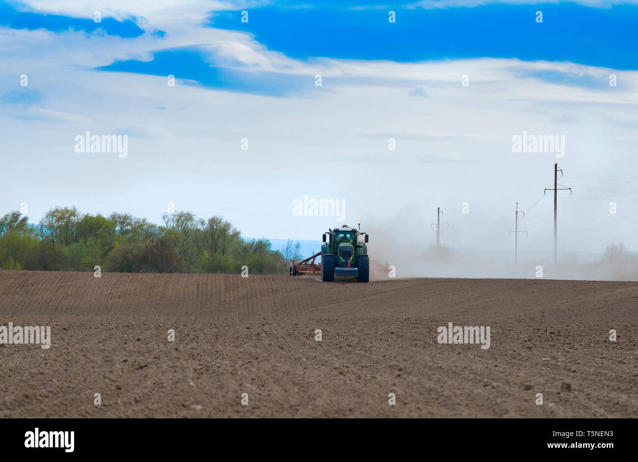 Farmer seeding, sowing crops at field. Sowing is the process of ...