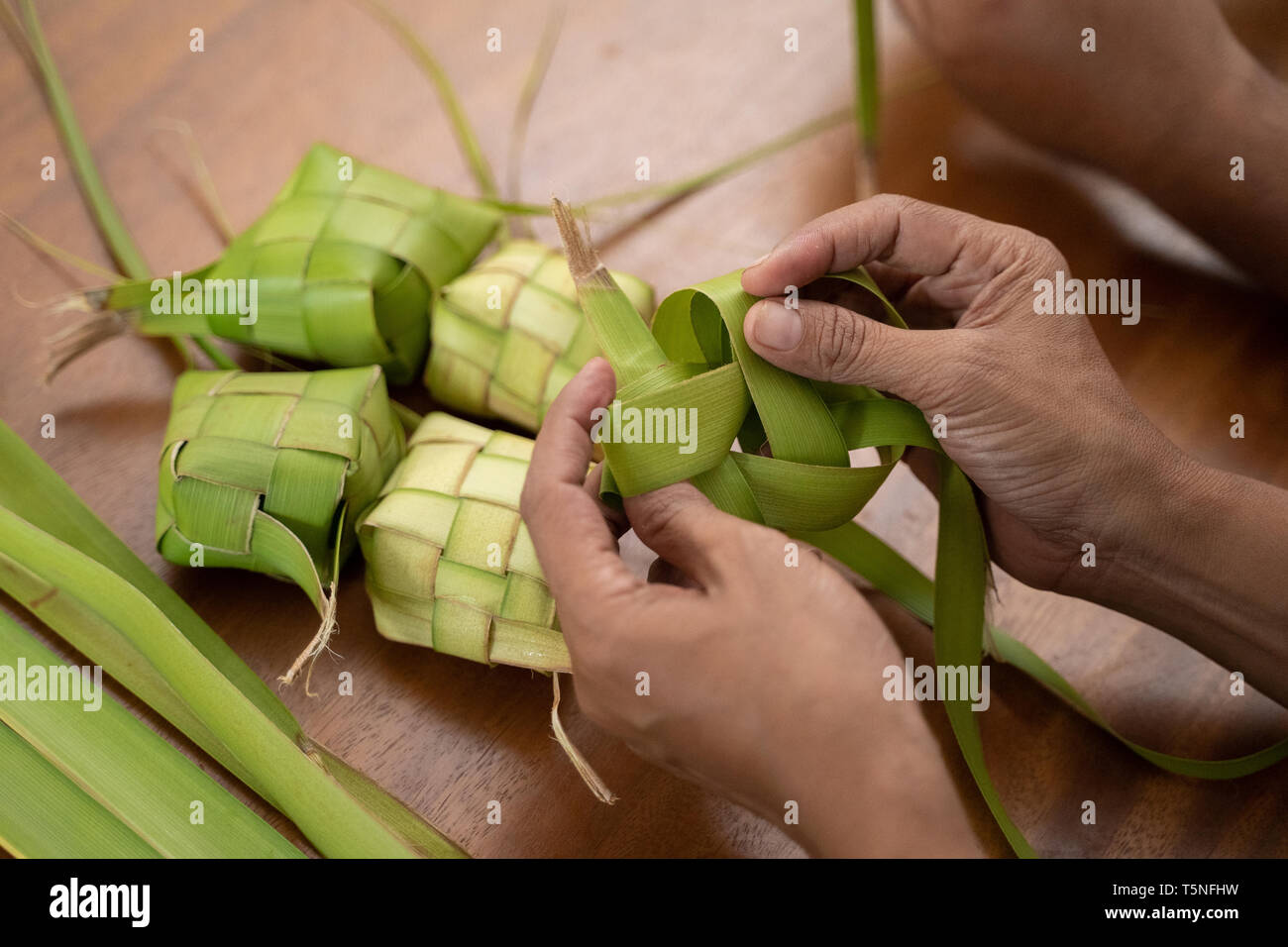 making ketupat traditional indonesian rice cake Stock Photo - Alamy