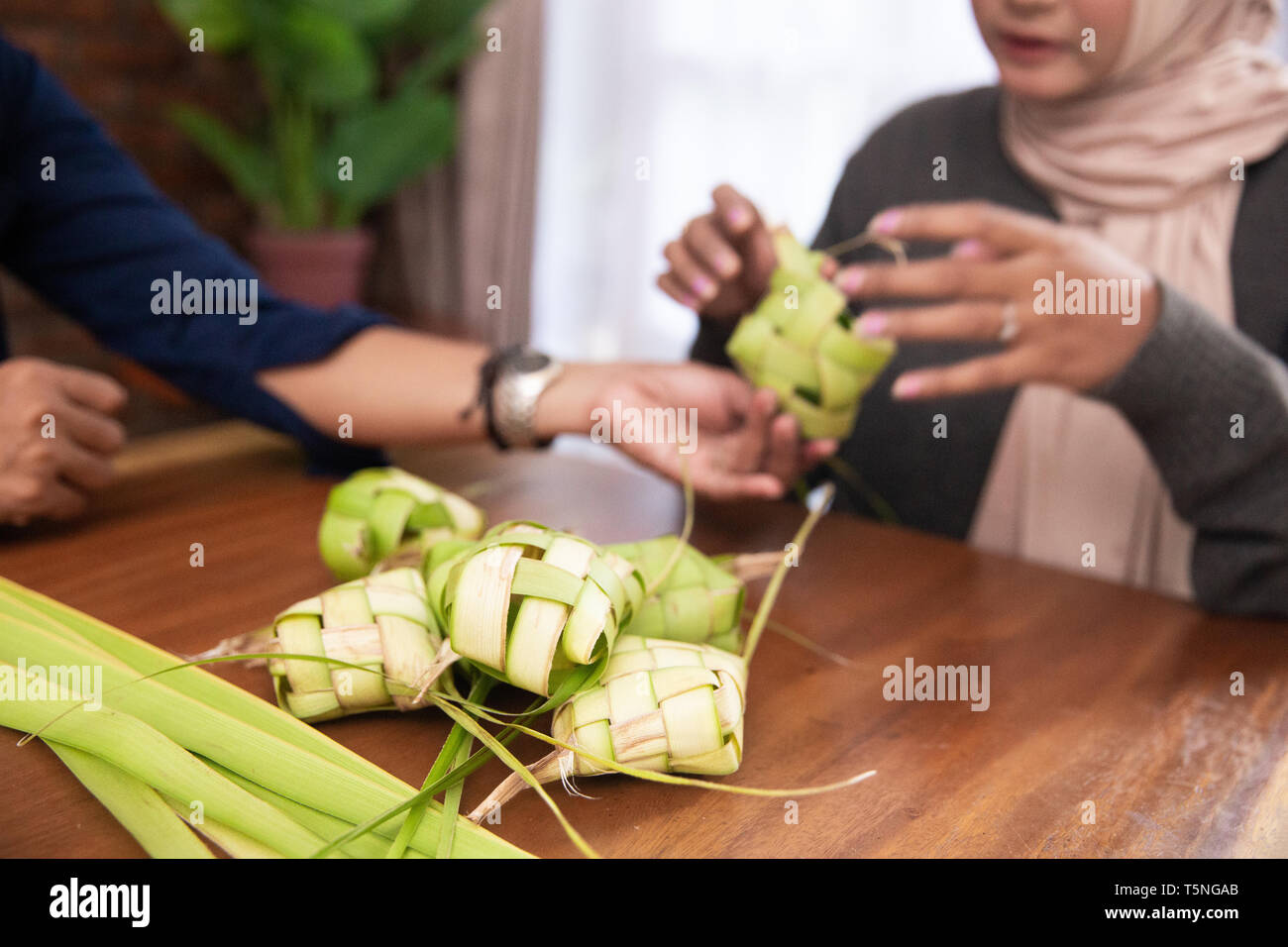 making ketupat traditional indonesian rice cake Stock Photo - Alamy