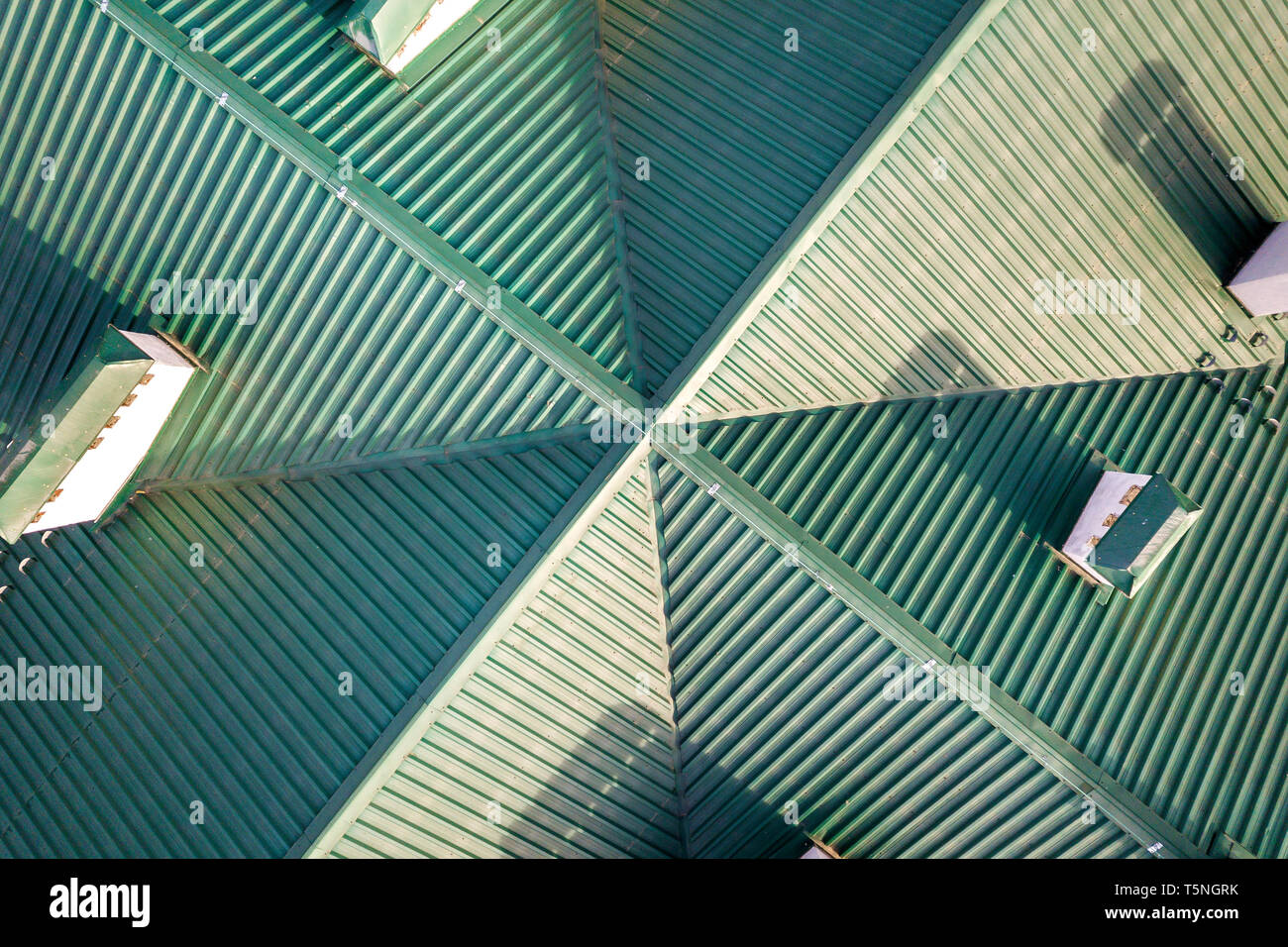 Top aerial view of building green shingle tiled roof construction ...