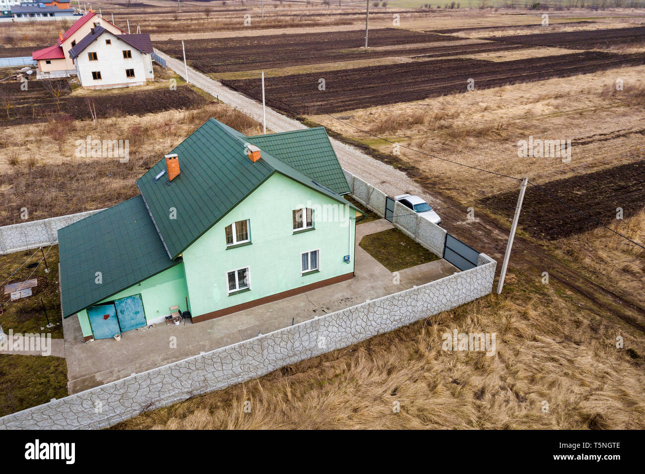 Aerial top view of new residential house cottage with brick chimney and ...