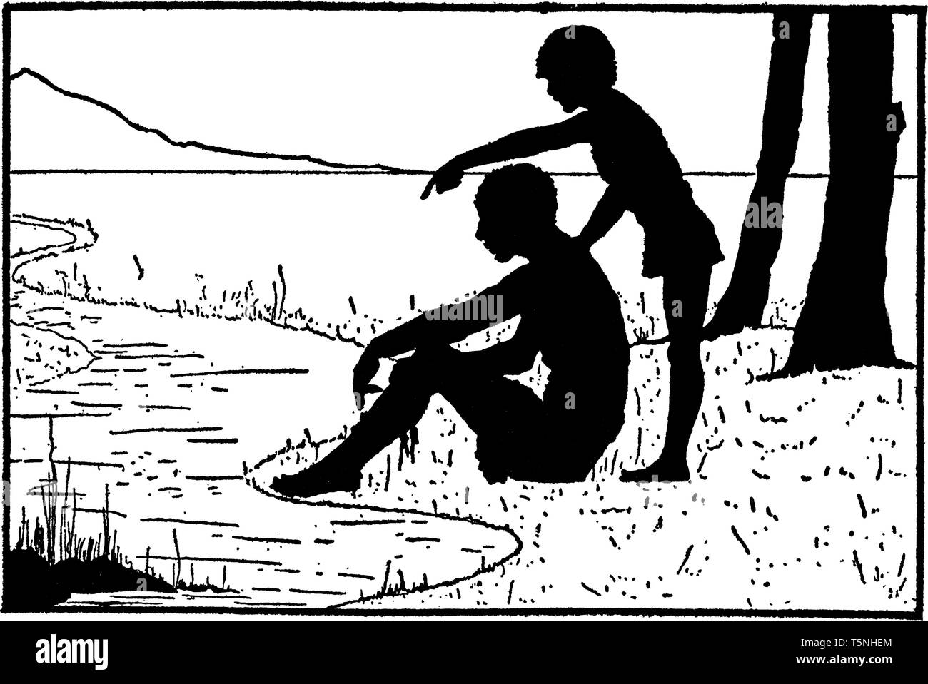 A man sitting on shore of lake and boy standing behind him, vintage ...