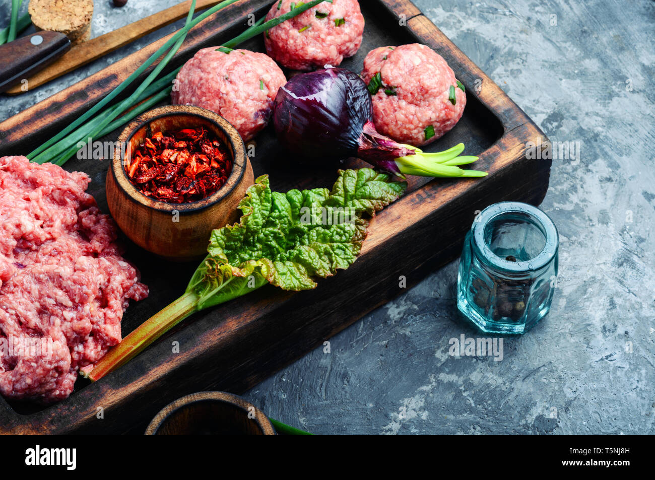 Meat balls from raw beef force-meat on kitchen board Stock Photo - Alamy