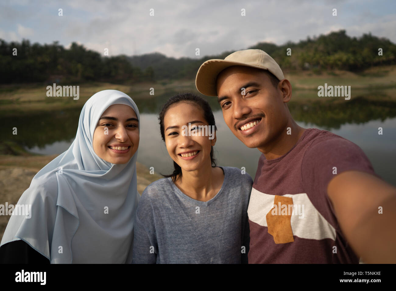 selfie three friend and muslim woman Stock Photo - Alamy