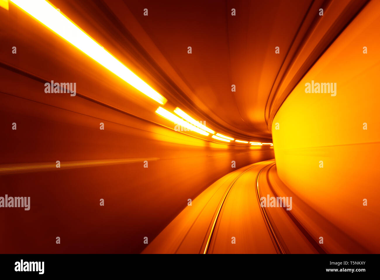 Speed motion blurred underground subway tunnel yellow color toned Stock ...