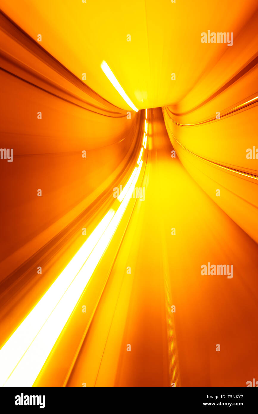 Speed motion blurred underground subway tunnel yellow color toned Stock ...