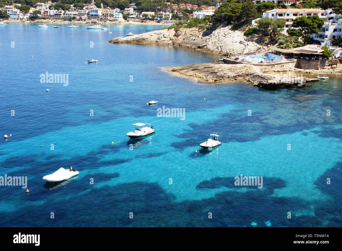 Mallorca Sant Elm Boats in clear blue Sea Stock Photo - Alamy