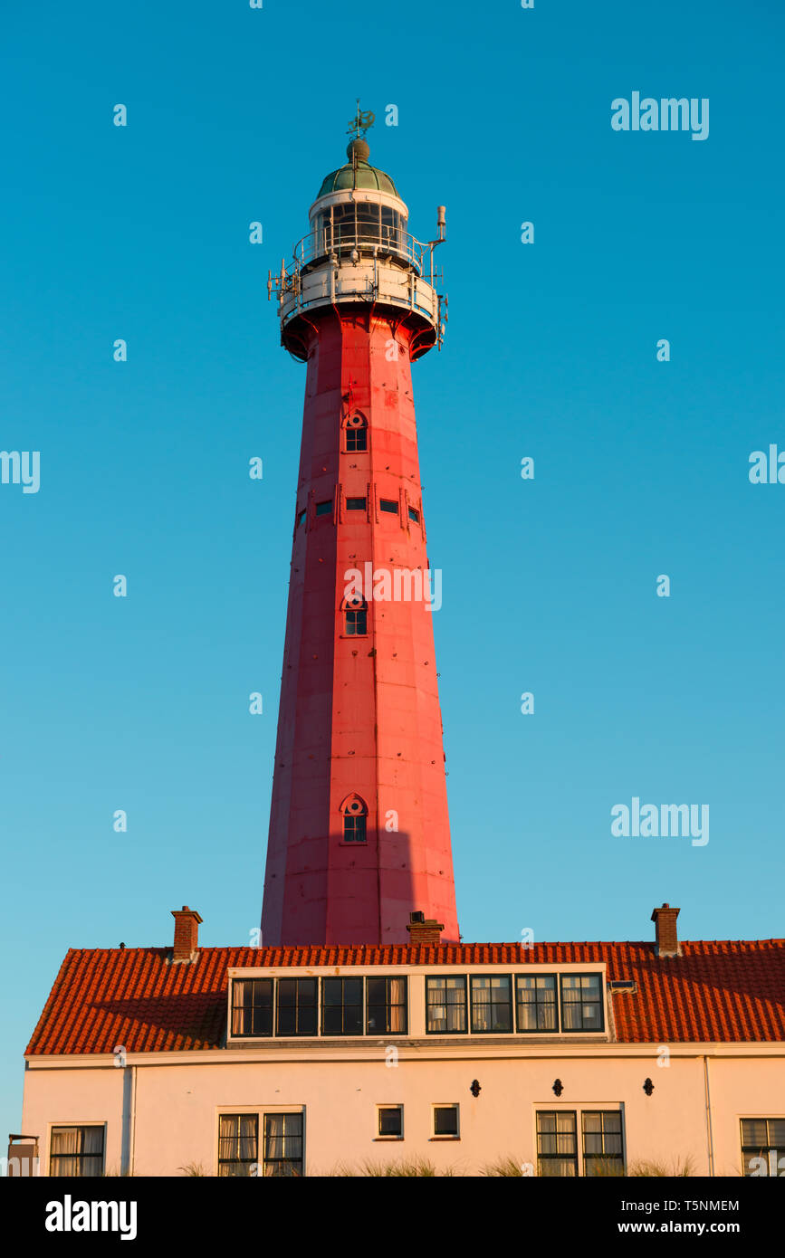 Scheveningen Lighthouse in Netherlands during sunset warm light Stock ...