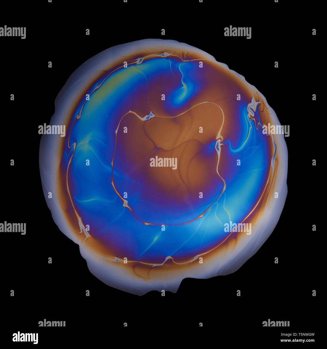 Vivid iridescent film of oil spill isolated on black background Stock ...