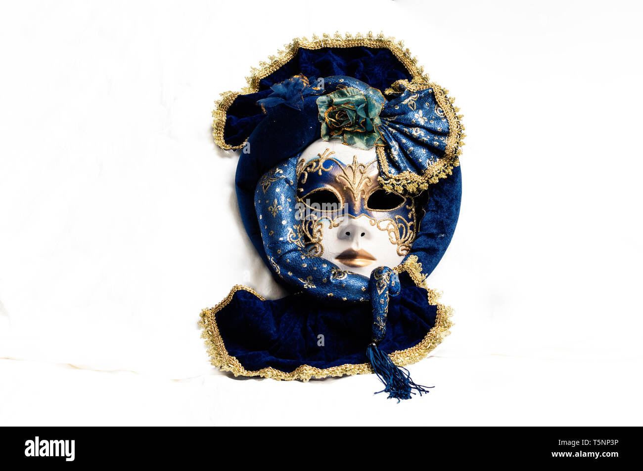 blue with gold elegant traditional venetian mask over white background ...