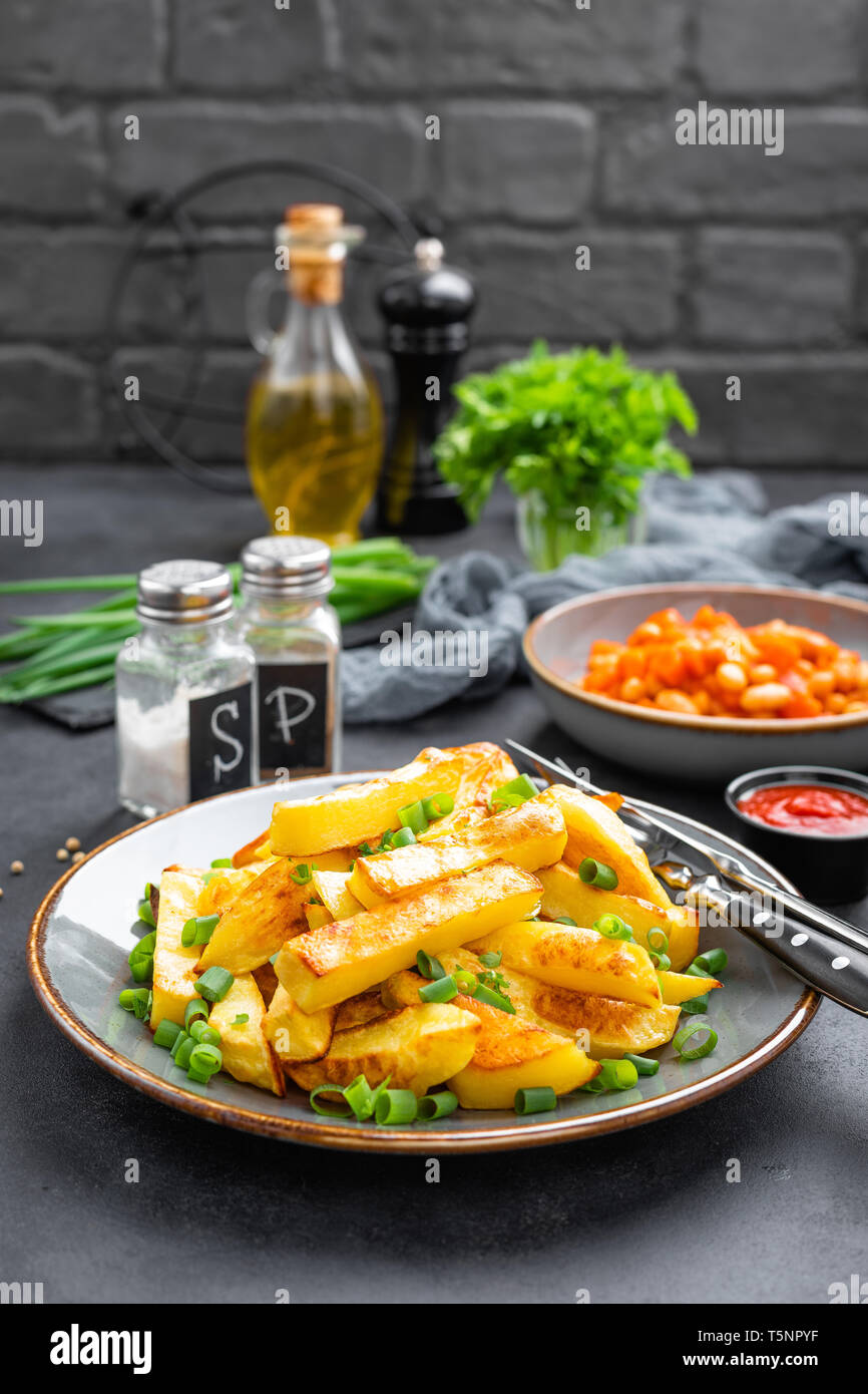 Baked, fried potato on plate Stock Photo - Alamy