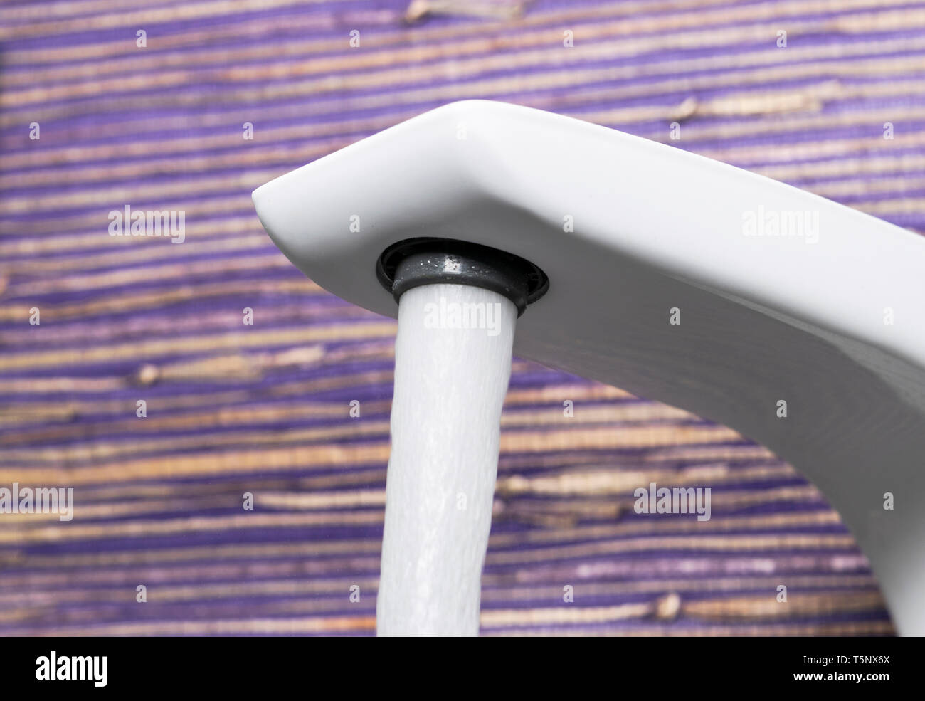 The water tap with water stream and drops. Faucet for the bathroom and ...