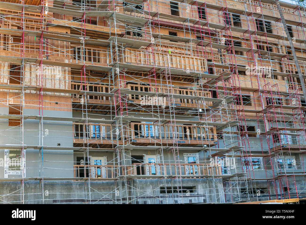 Building under construction using scaffolding Stock Photo - Alamy