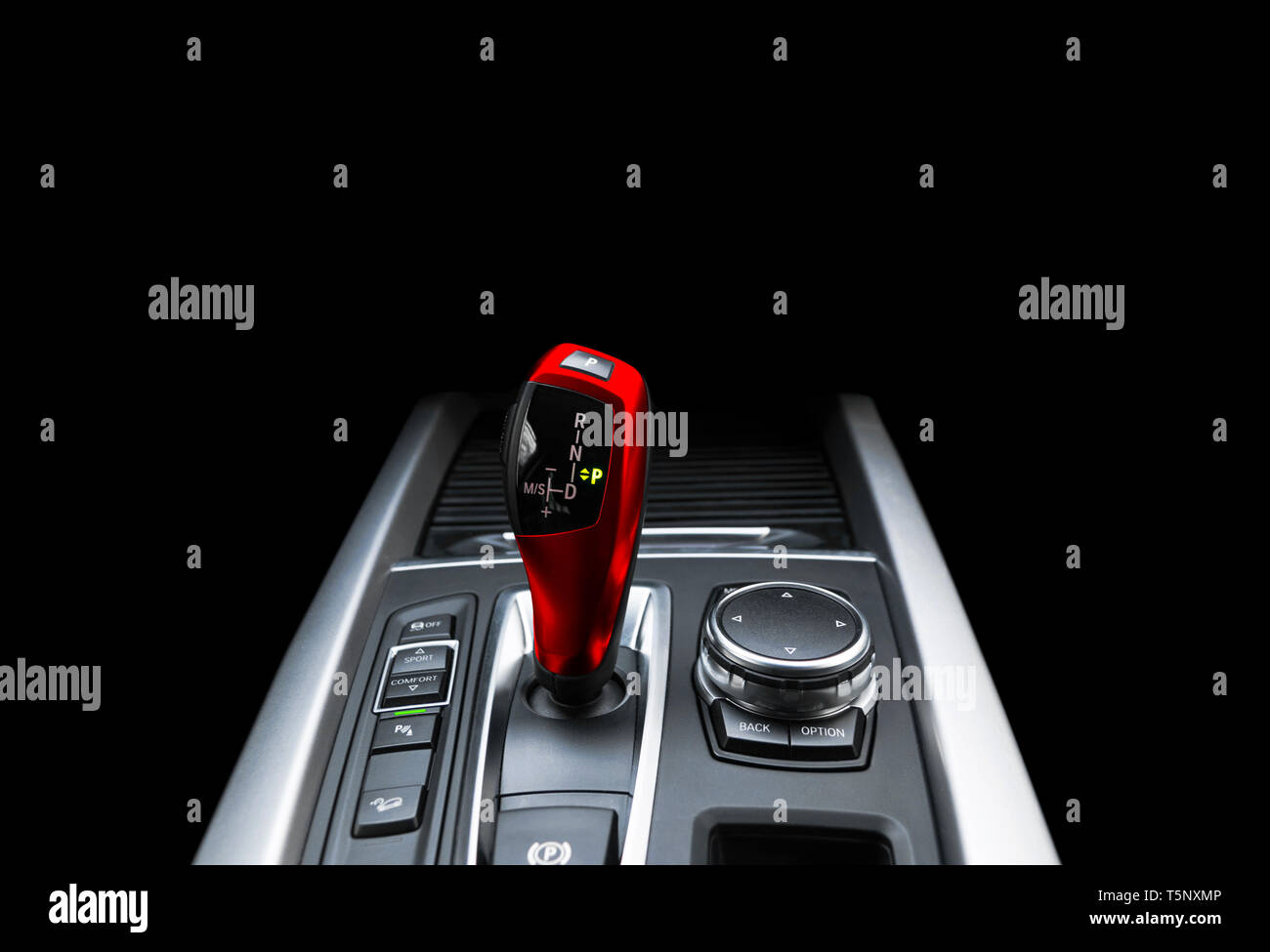 Red Automatic gear stick of a modern car. Maodern car interior details. Close up view. Car ...