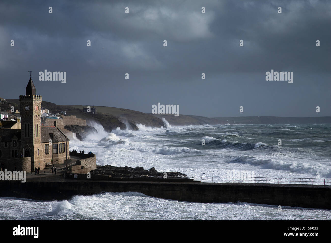 Porthleven pier with crashing storm waves hi-res stock photography and ...
