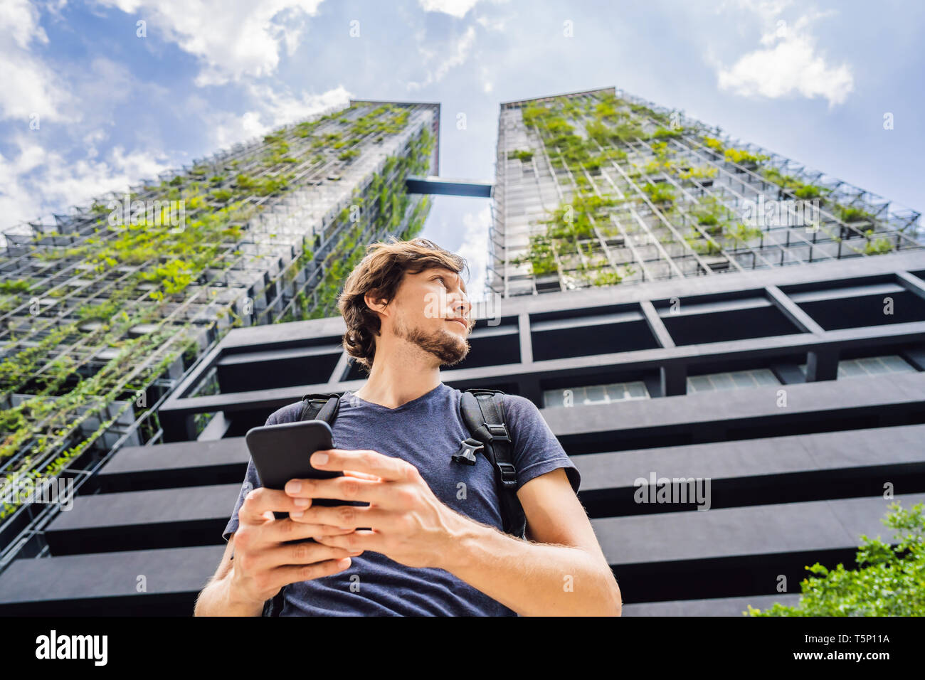 man using map app on smartphone on the background of skyscrapers Stock ...