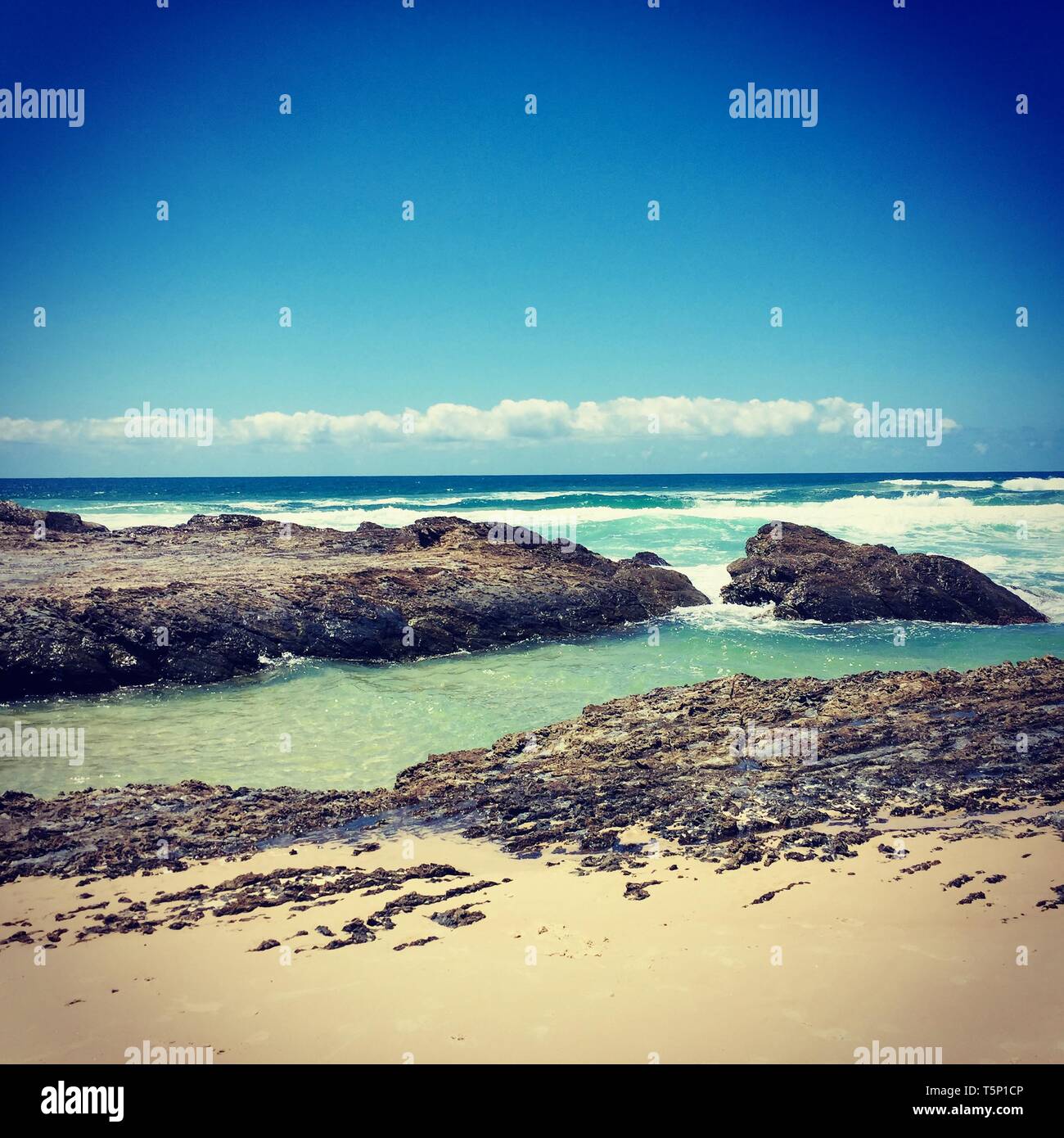 sunny beach with crystal clear blue turquoise water Stock Photo - Alamy