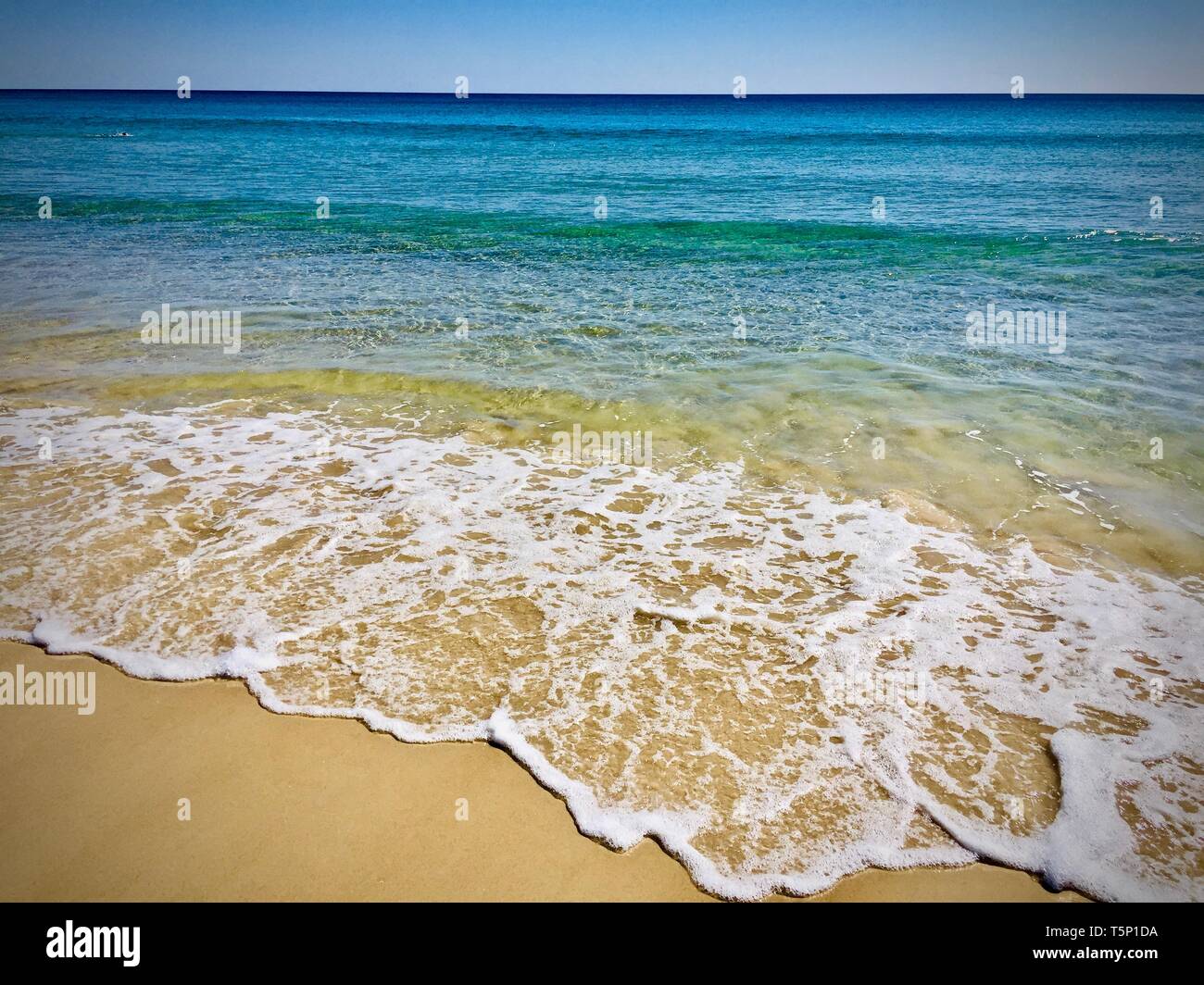sunny beach with crystal clear blue turquoise water Stock Photo - Alamy