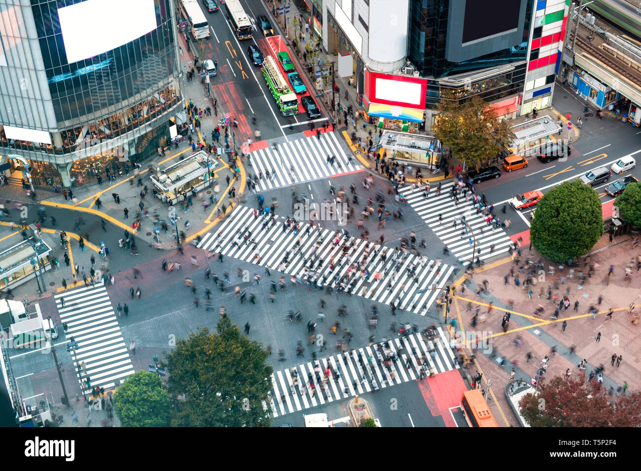 Aerial view of Pedestrians walking across with crowded traffic at ...