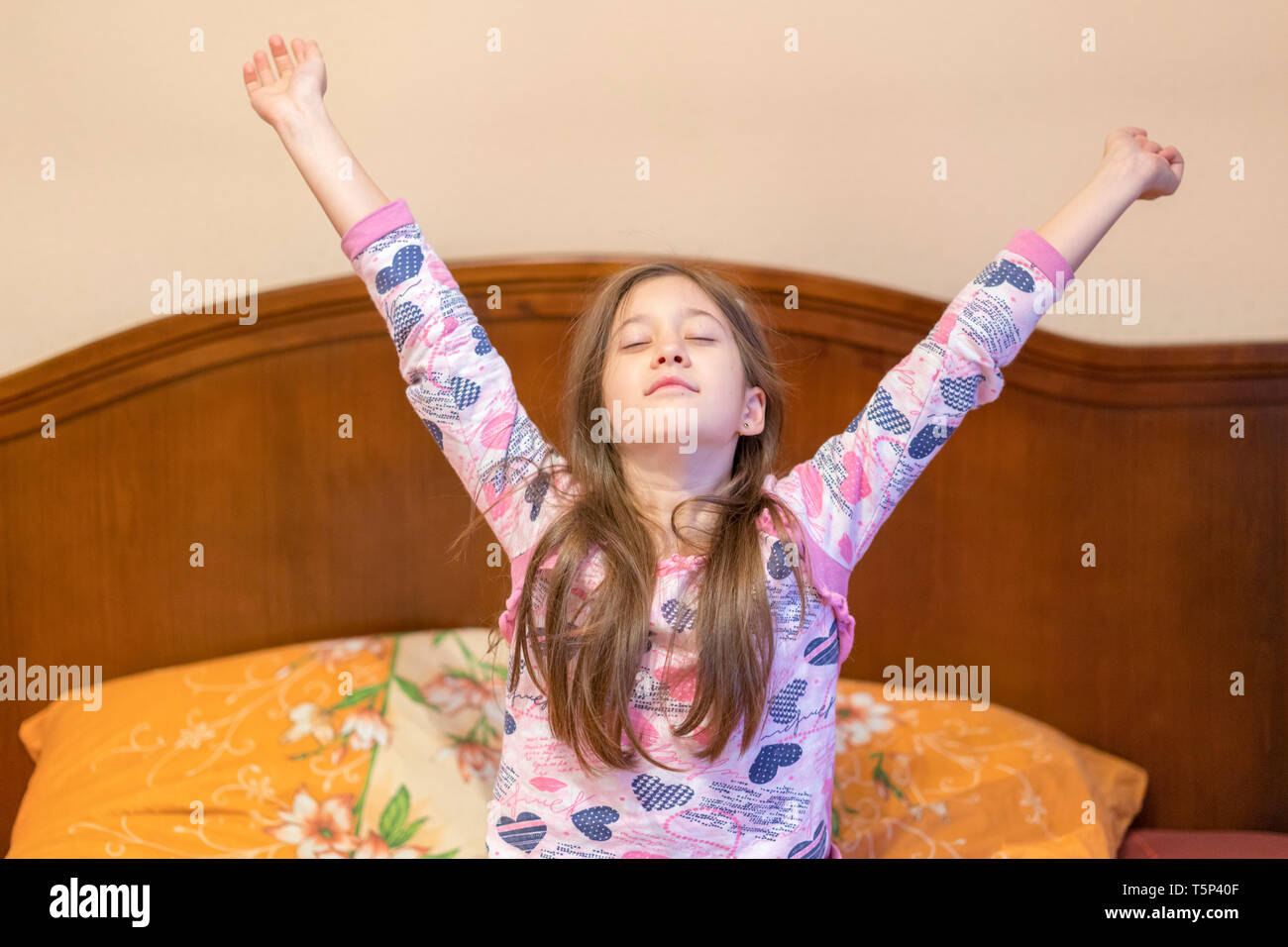 A nice child girl enjoys sunny morning. Good morning at home. Child ...