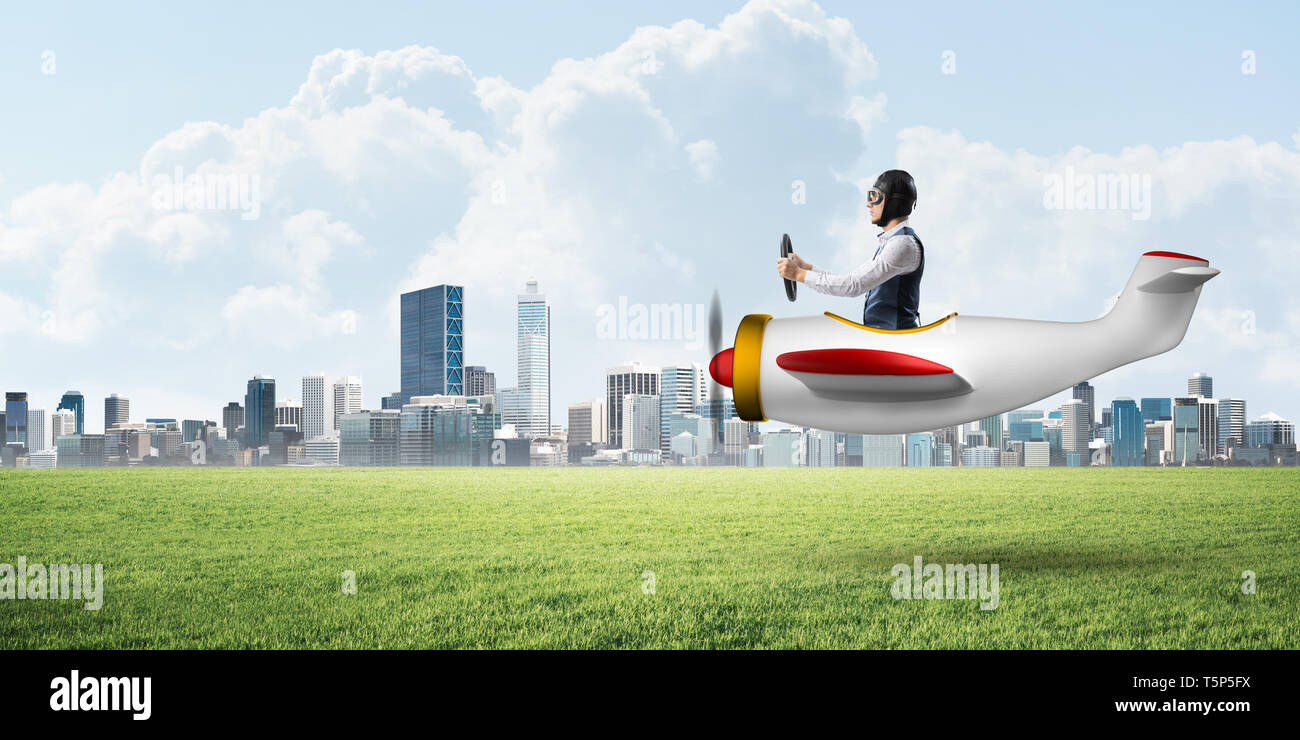 Happy aviator driving small propeller plane Stock Photo - Alamy