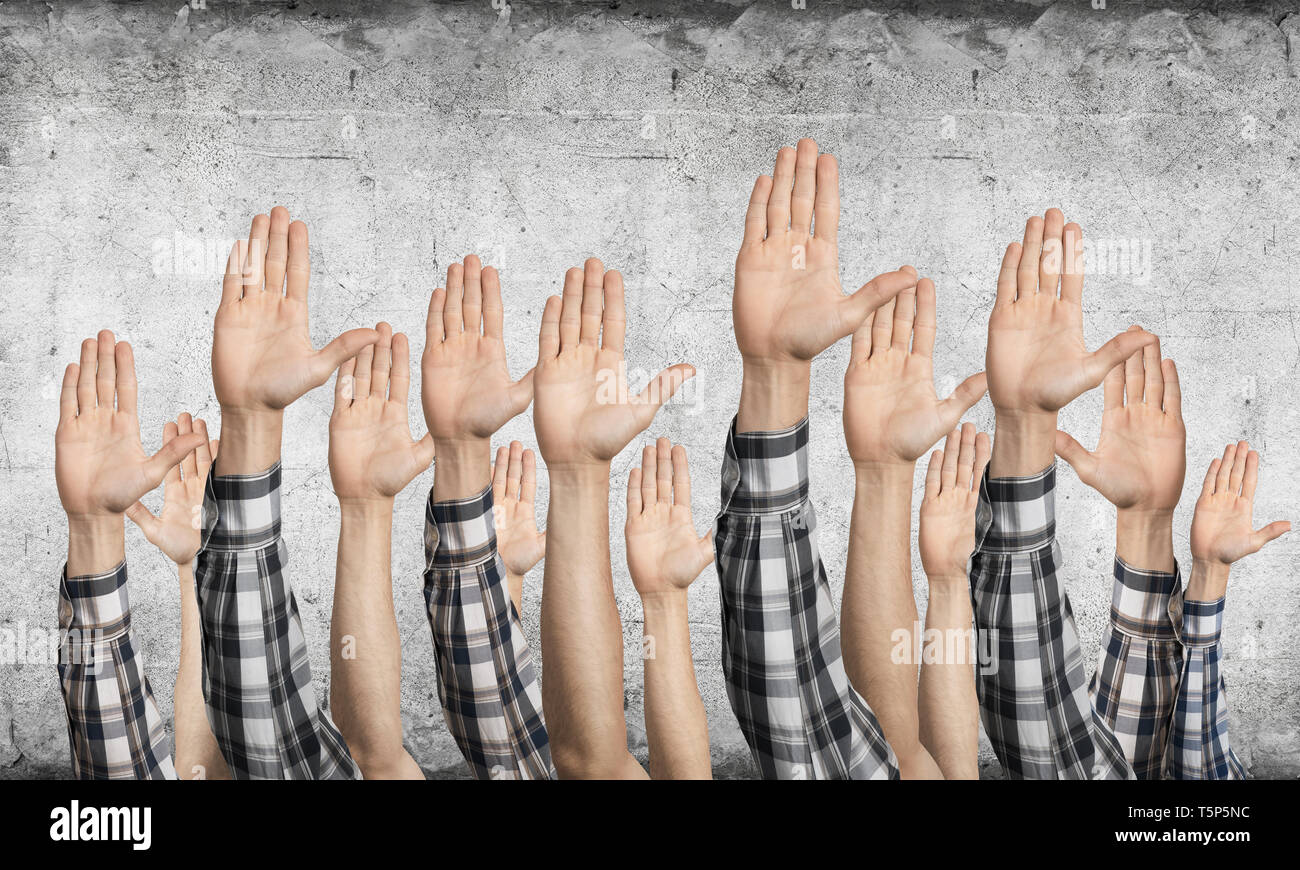 Row of man hands showing voting gesture Stock Photo - Alamy