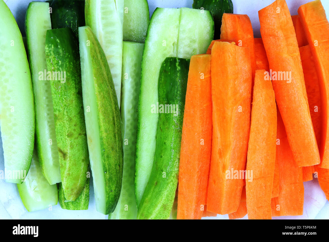 Fresh cucumber and carrots slice isolated on white background High ...