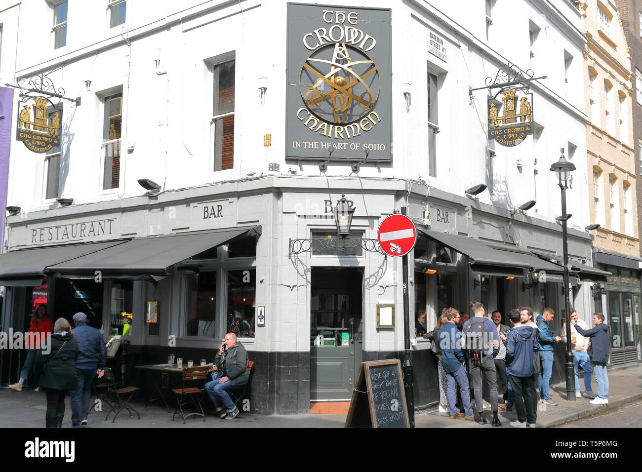 People drinking outside the Crown & two chairmen pub in Soho, London ...