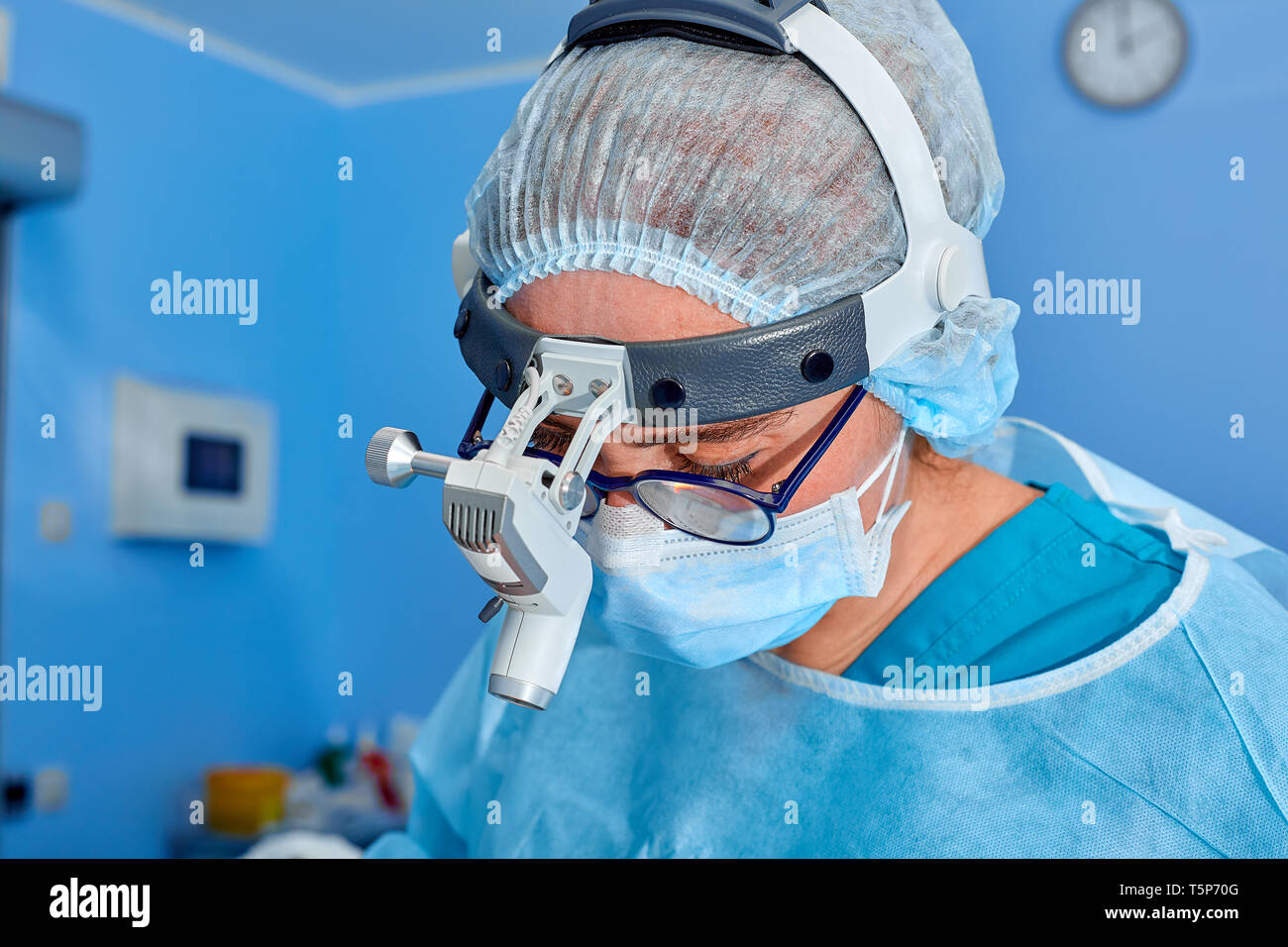 photo of the operating surgeon in the surgery room. Surgeon in mask and ...