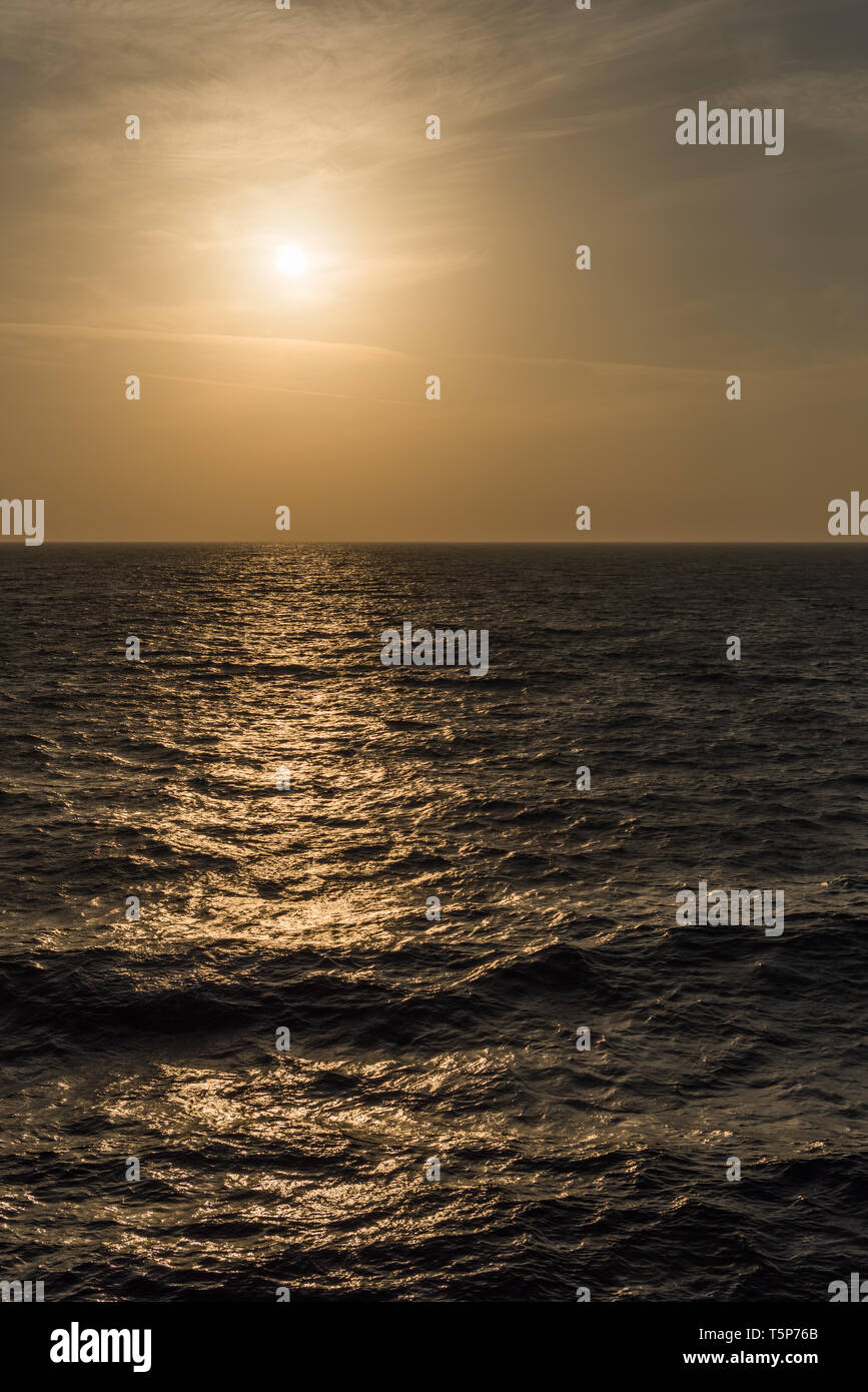 Orange sunset above sea from ship Stock Photo - Alamy