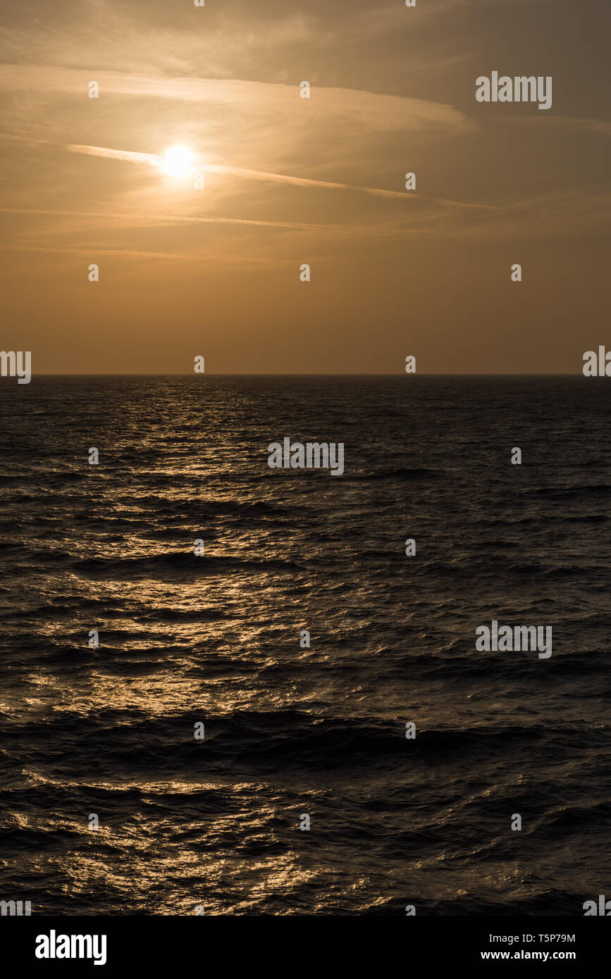 Orange sunset above sea from ship Stock Photo - Alamy