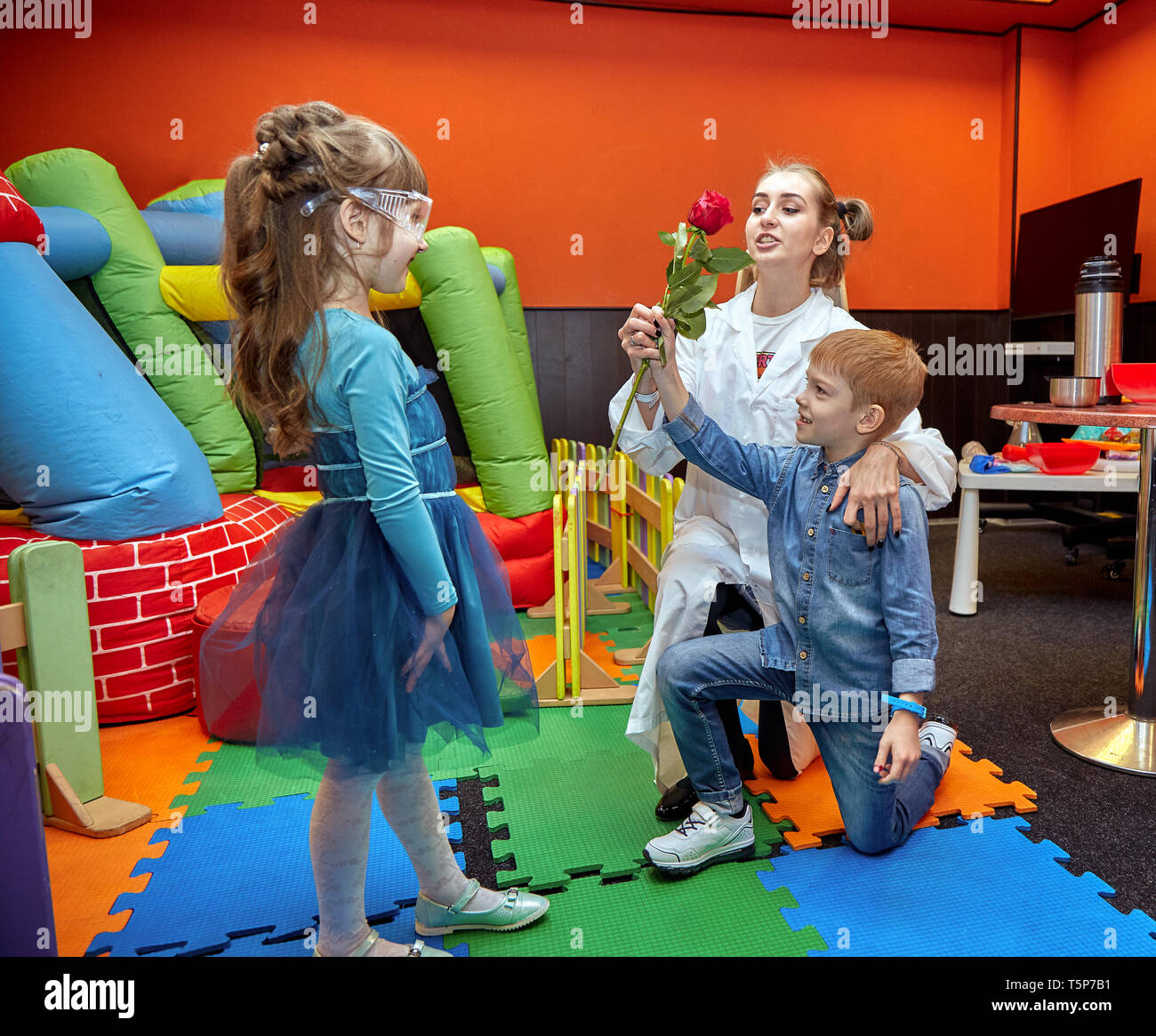 Chemical show for kids. Professor carried out chemical experiments with ...