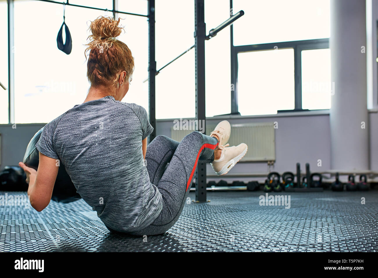 Woman Doing Exercises With Fitball In Fitness Gym Class Engaging Core