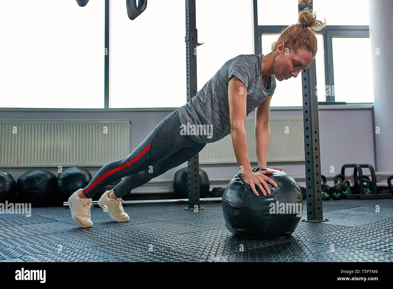 Woman Doing Exercises With Fitball In Fitness Gym Class Engaging Core