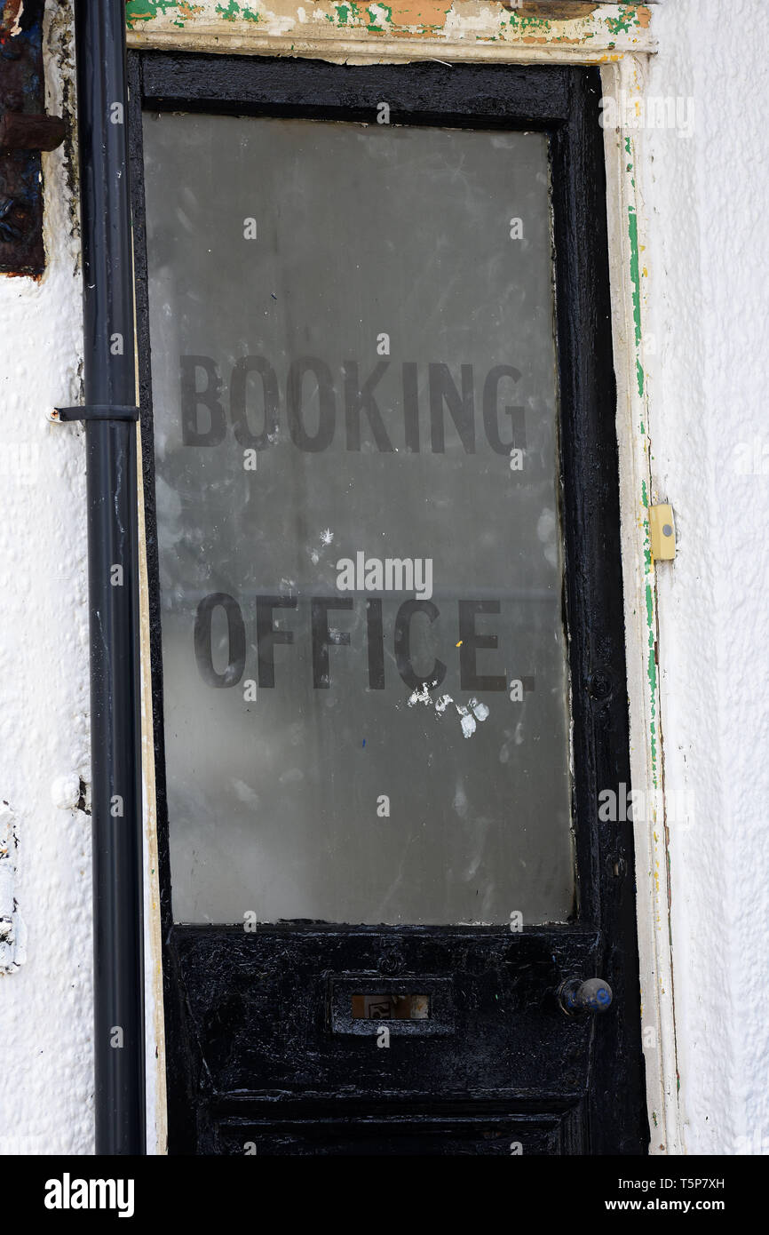 An old Booking Office door sign Stock Photo - Alamy