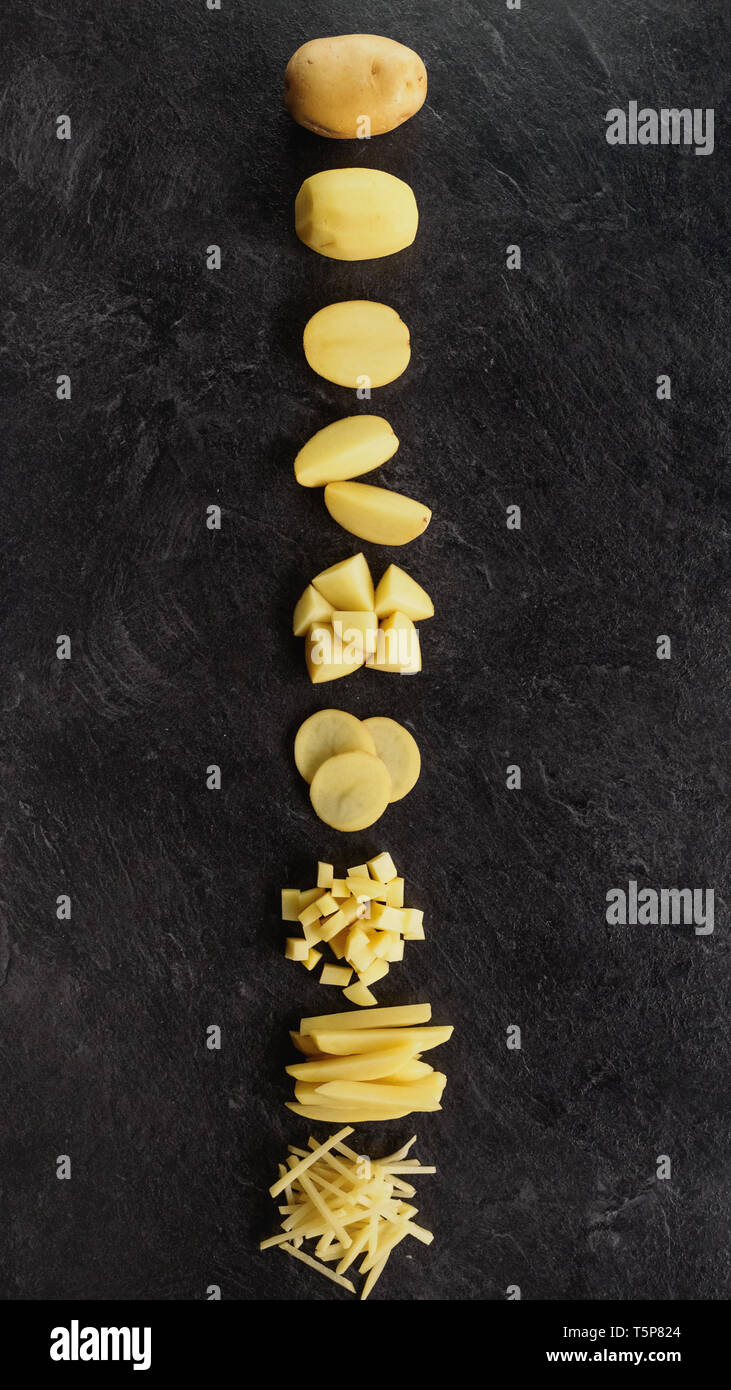 Different cuts of potatoes on a black textured background. Photo taken ...