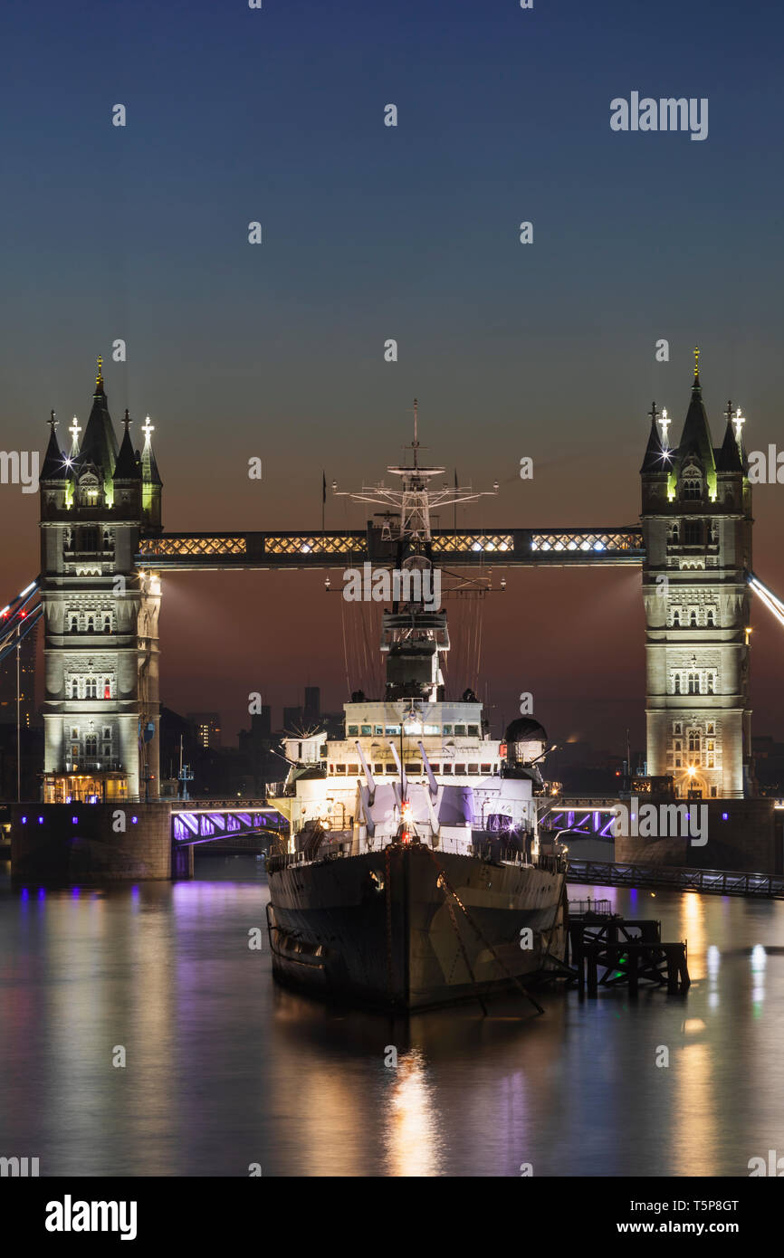 England, London, Tower Bridge and Museum Ship HMS Belfast at Dawn Stock ...