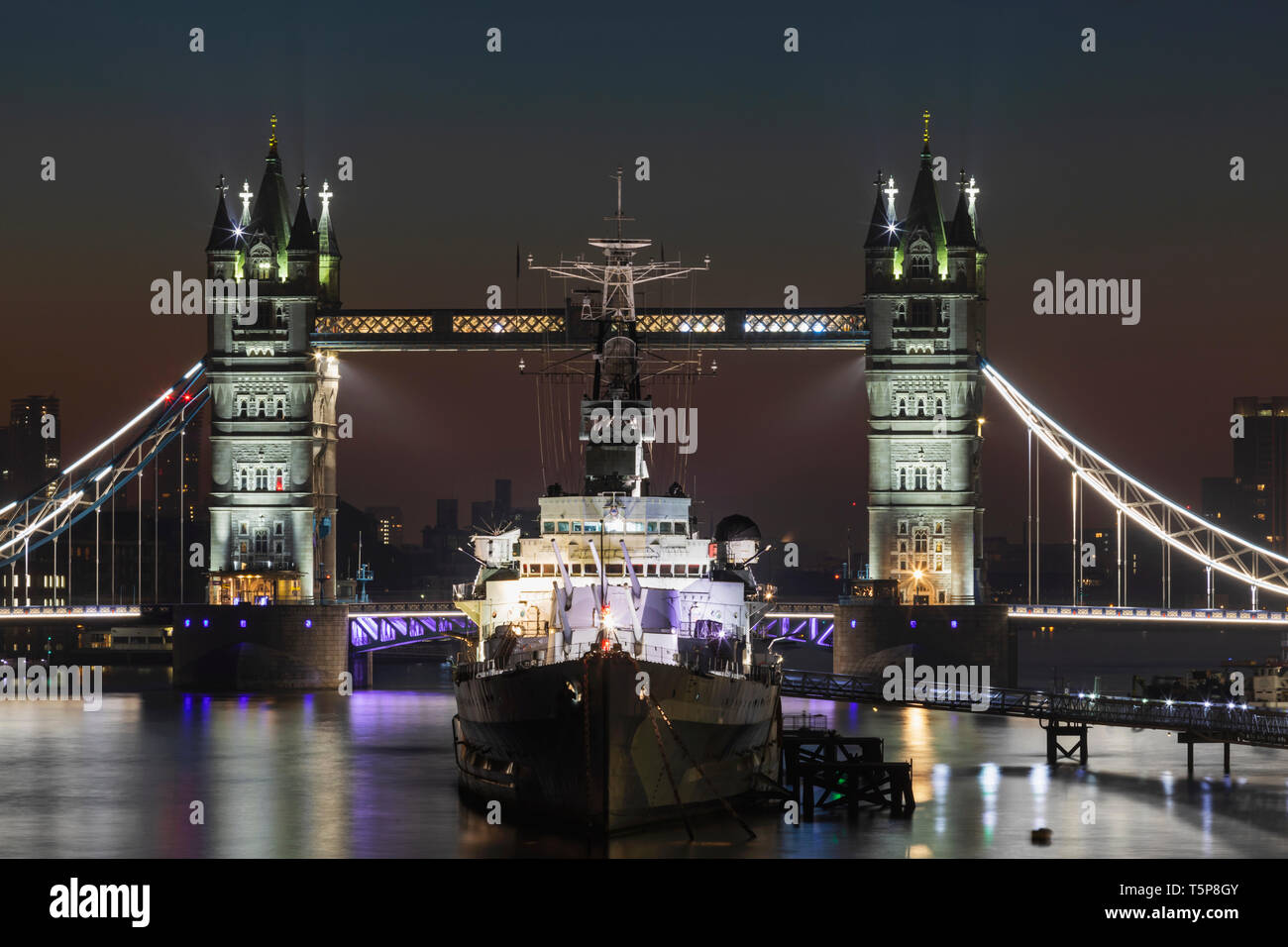 England, London, Tower Bridge and Museum Ship HMS Belfast at Dawn Stock ...
