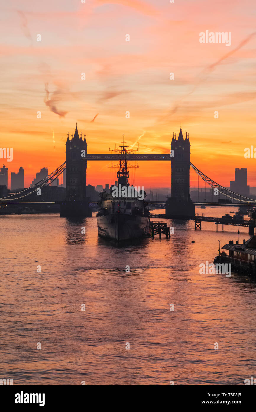 England, London, Tower Bridge and Museum Ship HMS Belfast at Dawn Stock ...