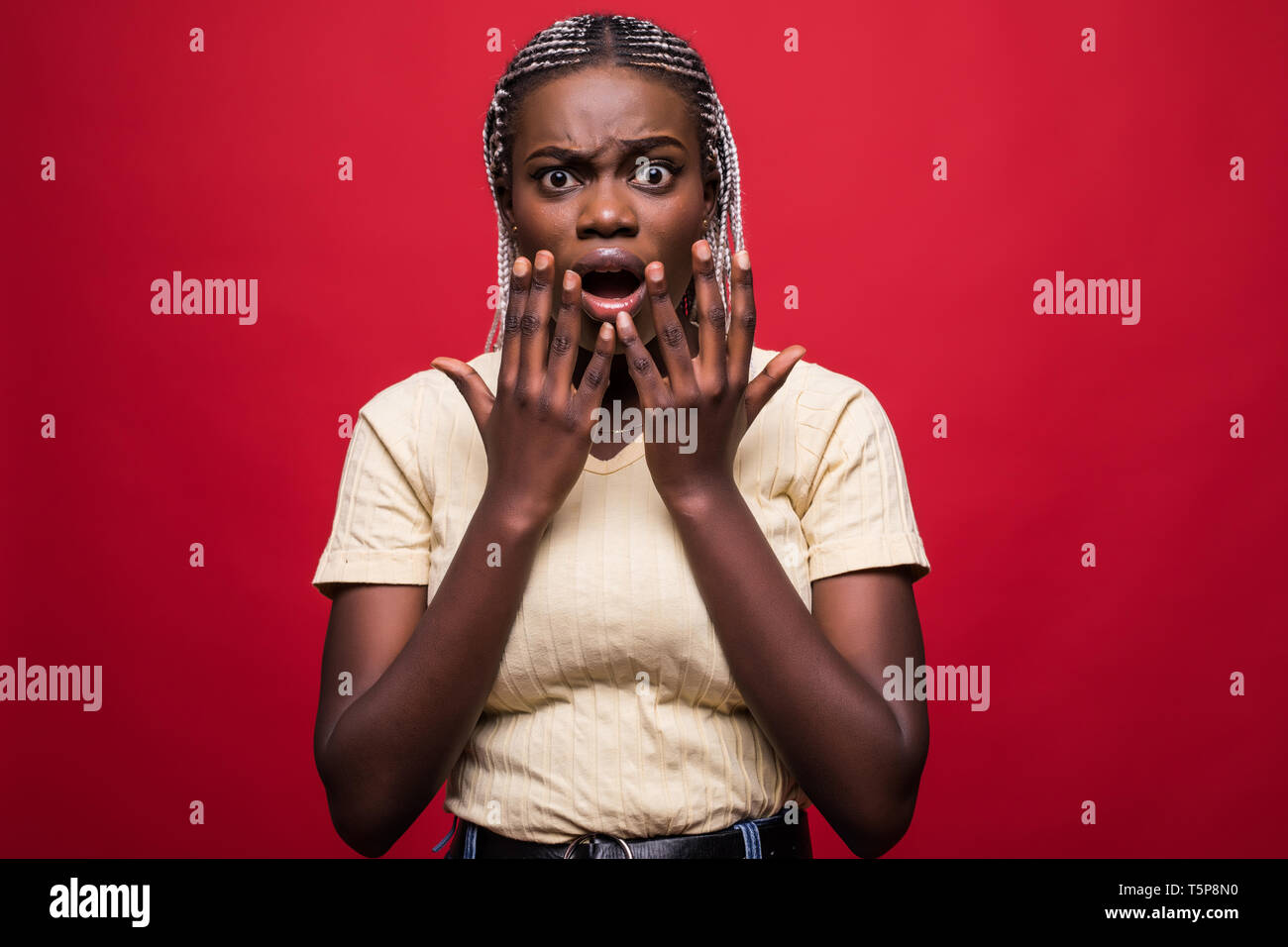 Headshot of beautiful scared young dark-skinned European female with ...