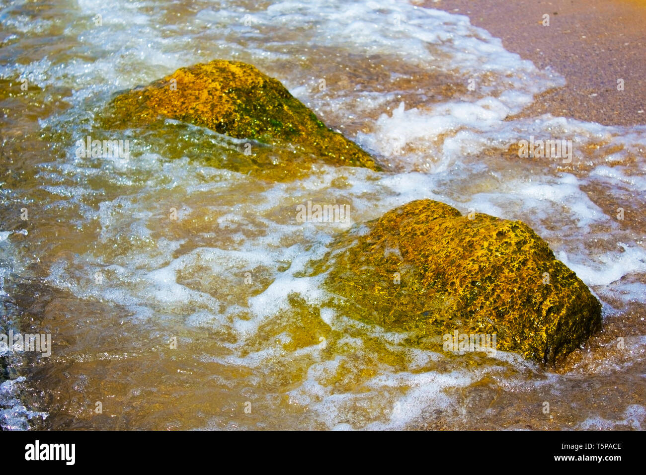 Sea waves hitting the shore rocks Stock Photo - Alamy