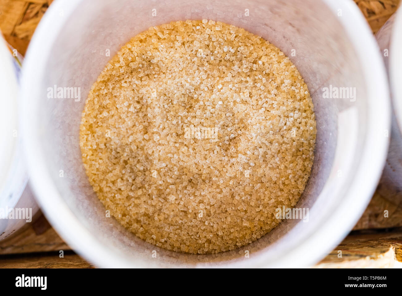 Granulated sugar in container sphere,top view Stock Photo - Alamy